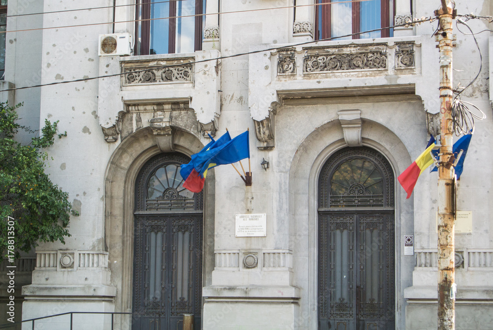 BUCHAREST, ROMANIA - JULY 29, 2017: Archetecture, state flags and trees ...