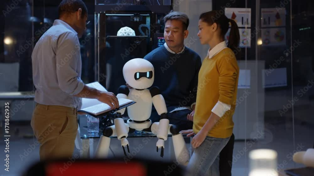 Electronics engineering team building robot with 3D printed components ...