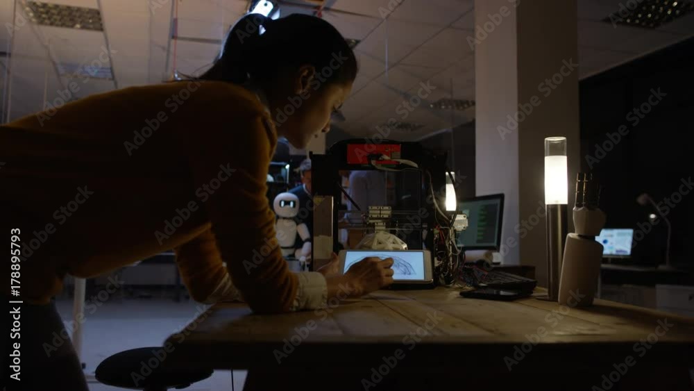 Electronics engineering team building robot with 3D printed components ...