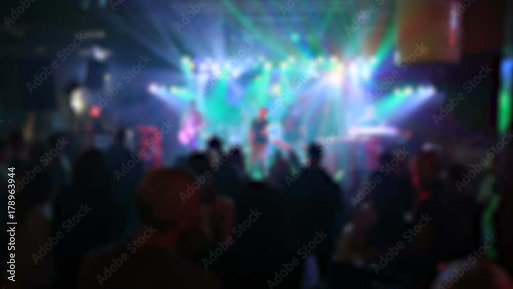 Band on Stage with Crowd Blur Light Show. a blurred shot of a band and ...