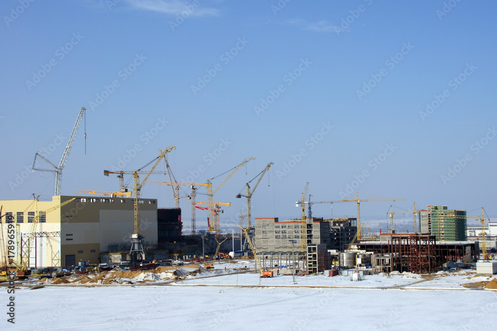 Construction industrial park with cranes. Winter building work. Urban ...