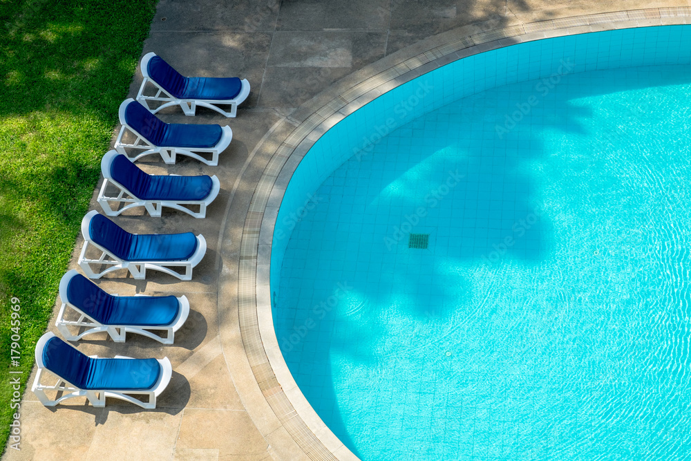 Relaxing Plastic chairs by the Swimming Pool side top view. Stock Photo ...