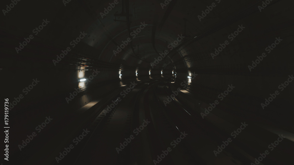 View of subway tunnel as seen from reverse of moving backward train ...