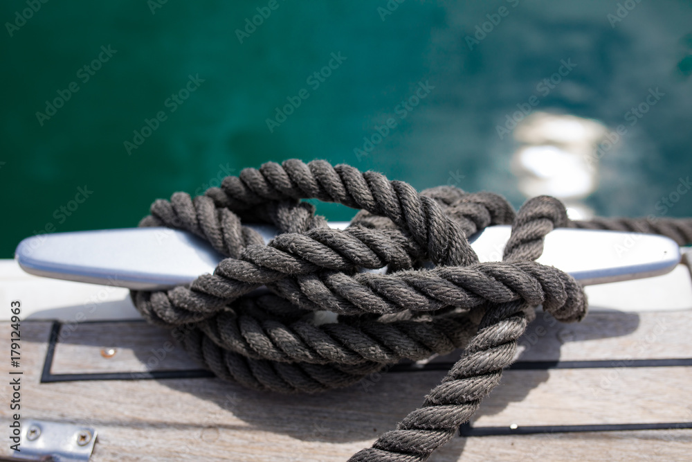 Cleat with rope. Pulleys and ropes, sheets and halyards or cleats on a ...