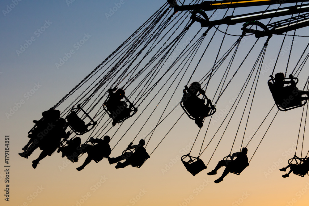 kids in silhouette on wave swinger Stock Photo | Adobe Stock