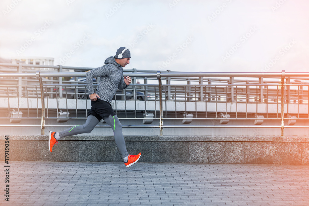 healthy lifestyle middle aged man runner running on city bridge road ...