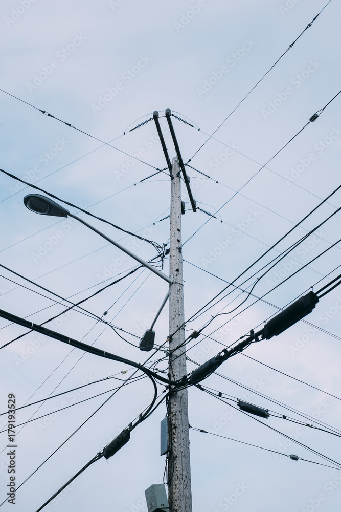 Telephone pole, street light and electrical wires Stock Photo | Adobe Stock