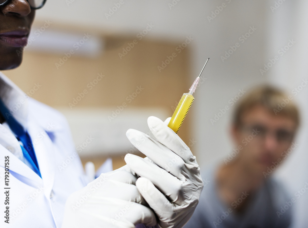 Doctor preparing for a vaccination Stock Photo | Adobe Stock