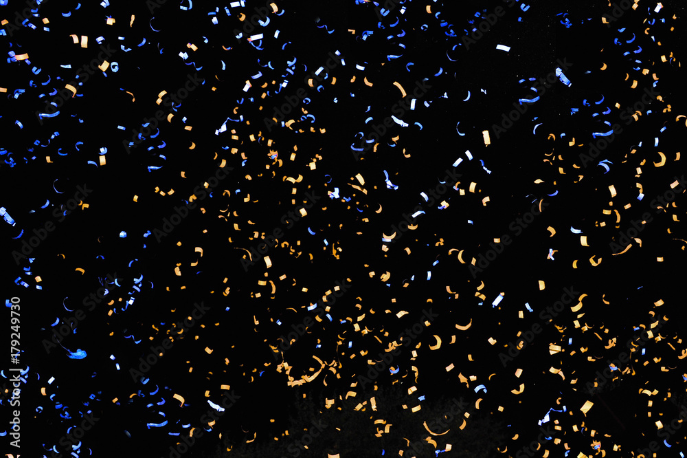 Confetti fired in the air during a beach party. Only confetti on black ...
