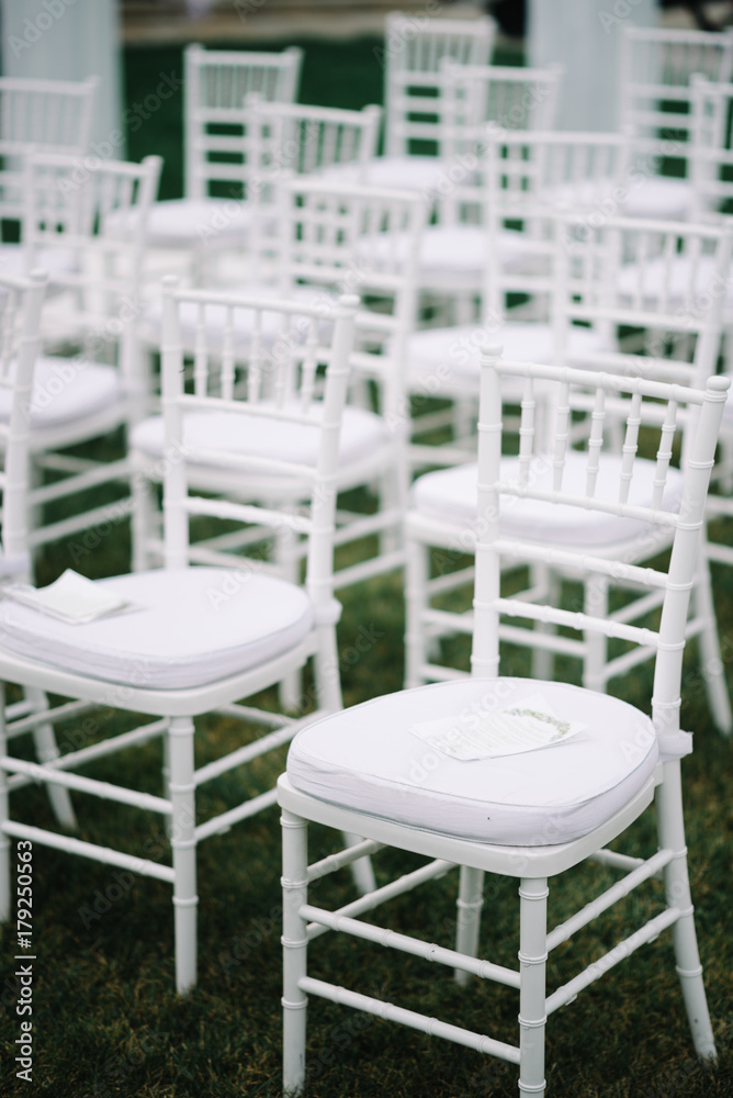 Empty white chairs before wedding ceremony Stock Photo | Adobe Stock