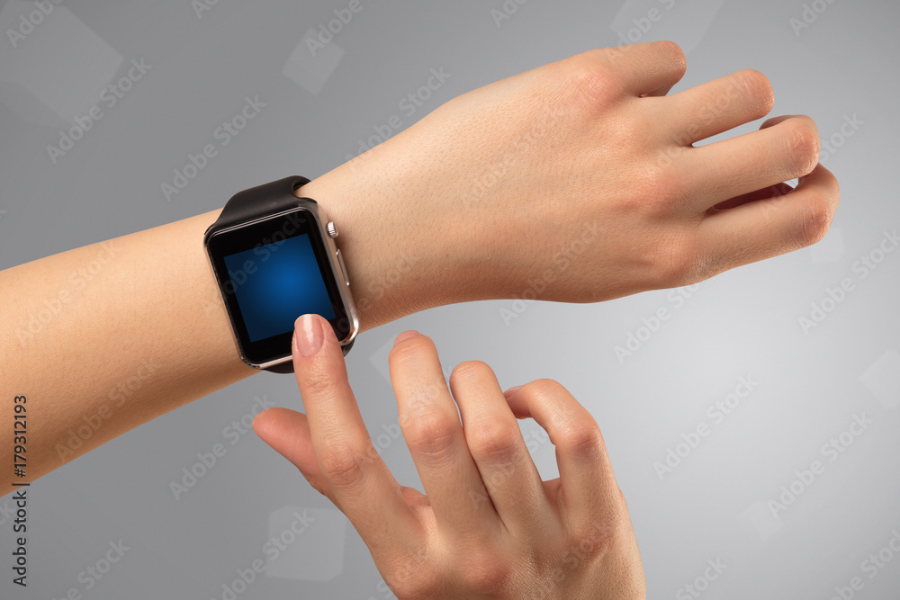 Female hand wearing smartwatch Stock Photo | Adobe Stock
