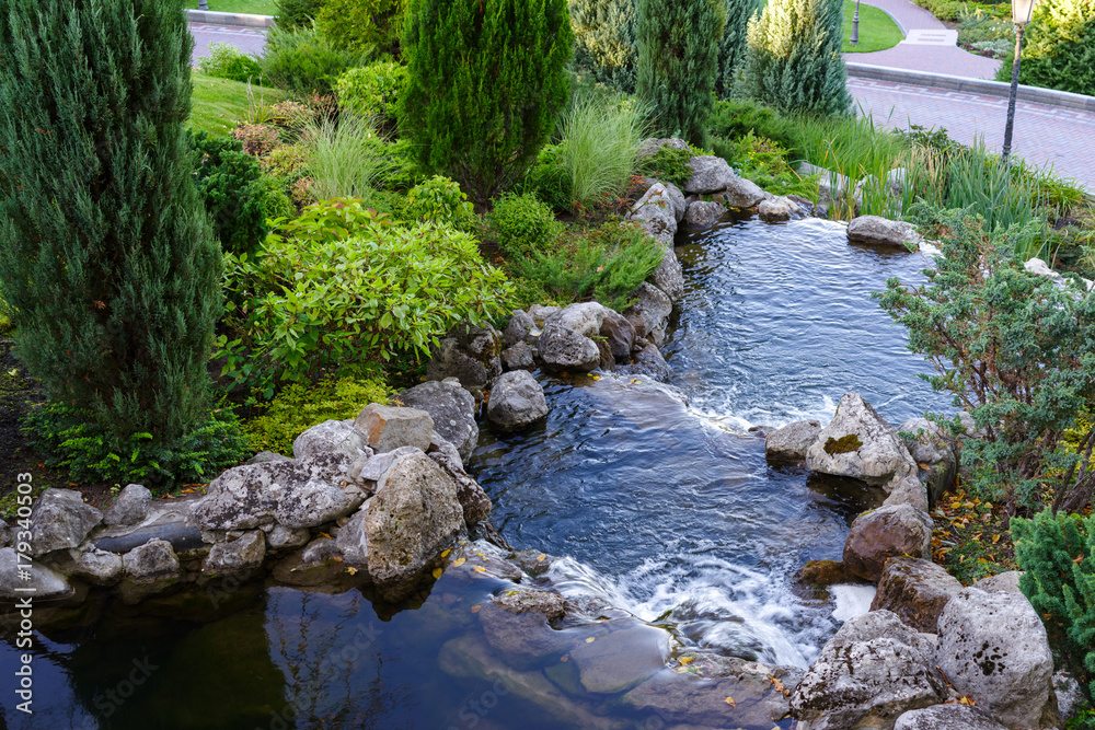 artificial pond with waterfalls in the landscape park Stock Photo ...
