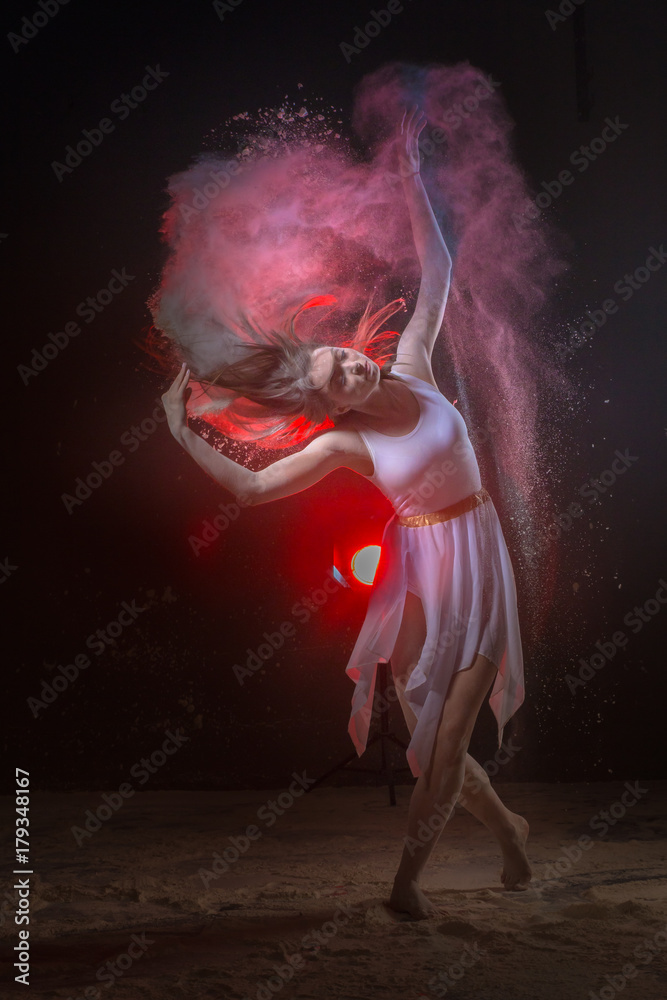 Beautiful slim female dancer in studio during Powder Photo Shoot with ...