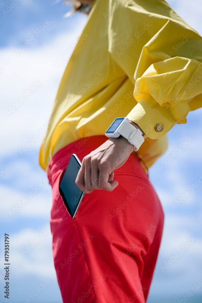Close up on unrecognizable person holding using mobile phone, abstract ...