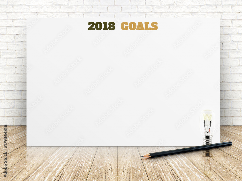 2018 goals of new year on white paper poster on wood plank floor and ...