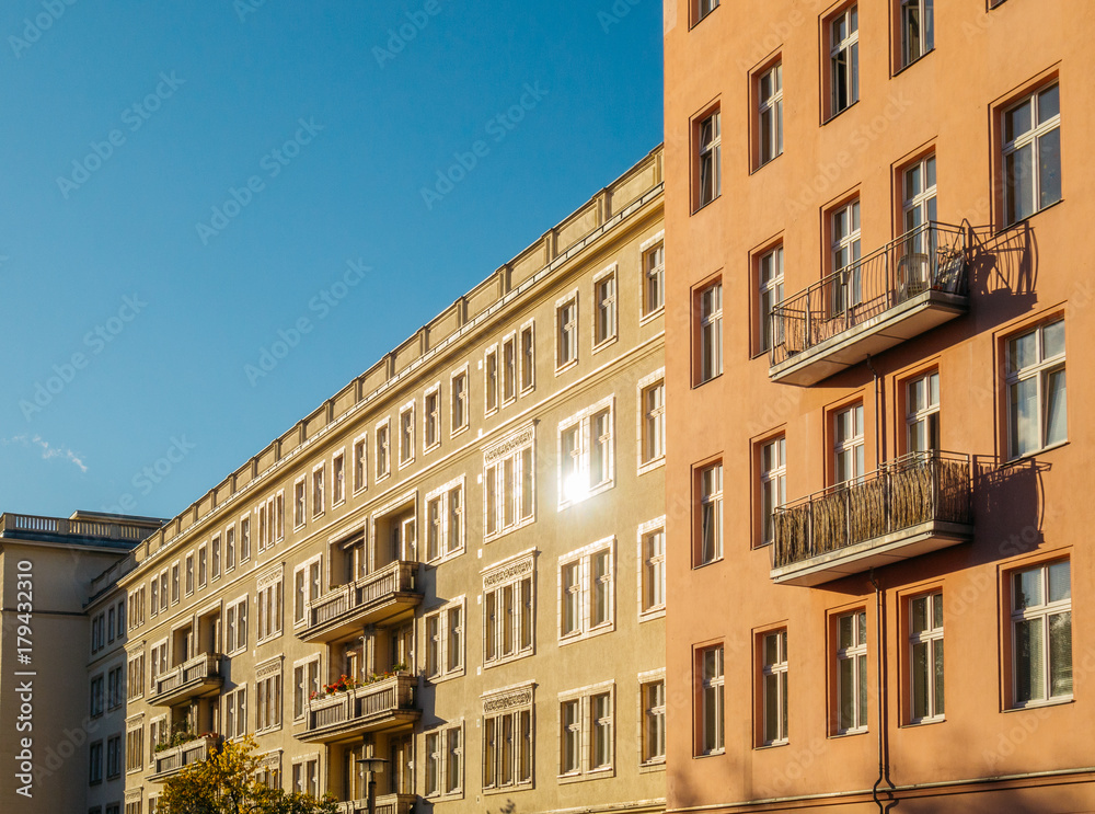 high contrasted picture of apartment building with lens flare in the ...