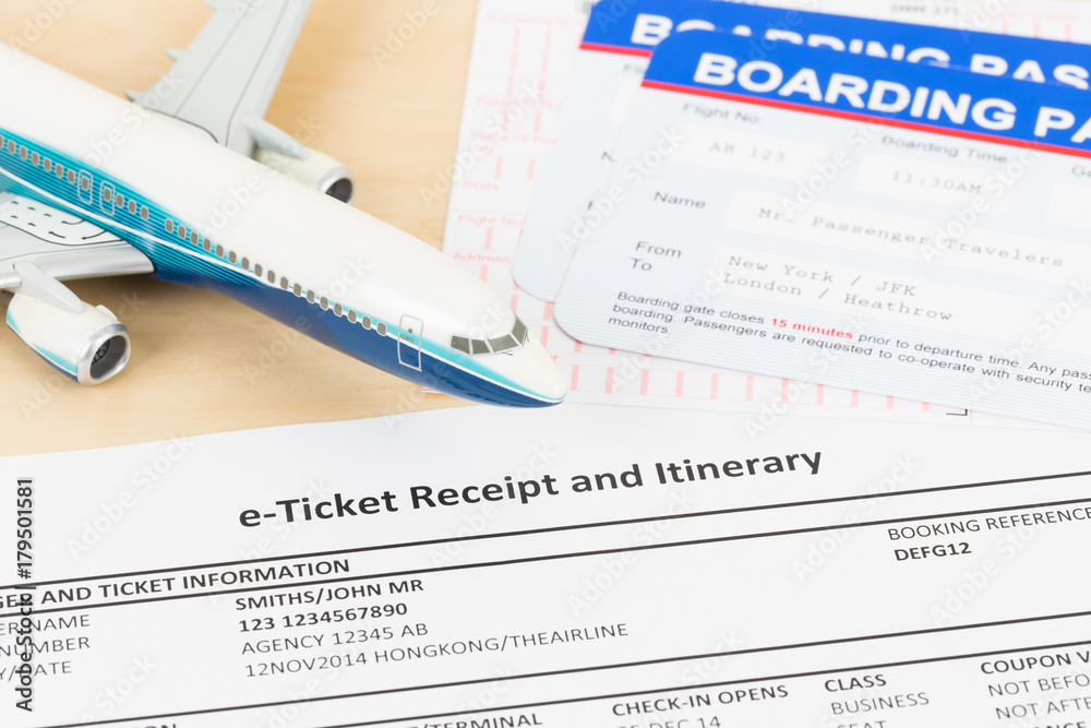 E-ticket with plane model, and boarding pass; these documents are mock ...