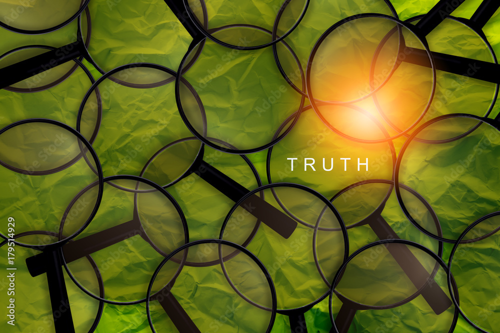 truth word with magnifying glass search on word with green paper ...