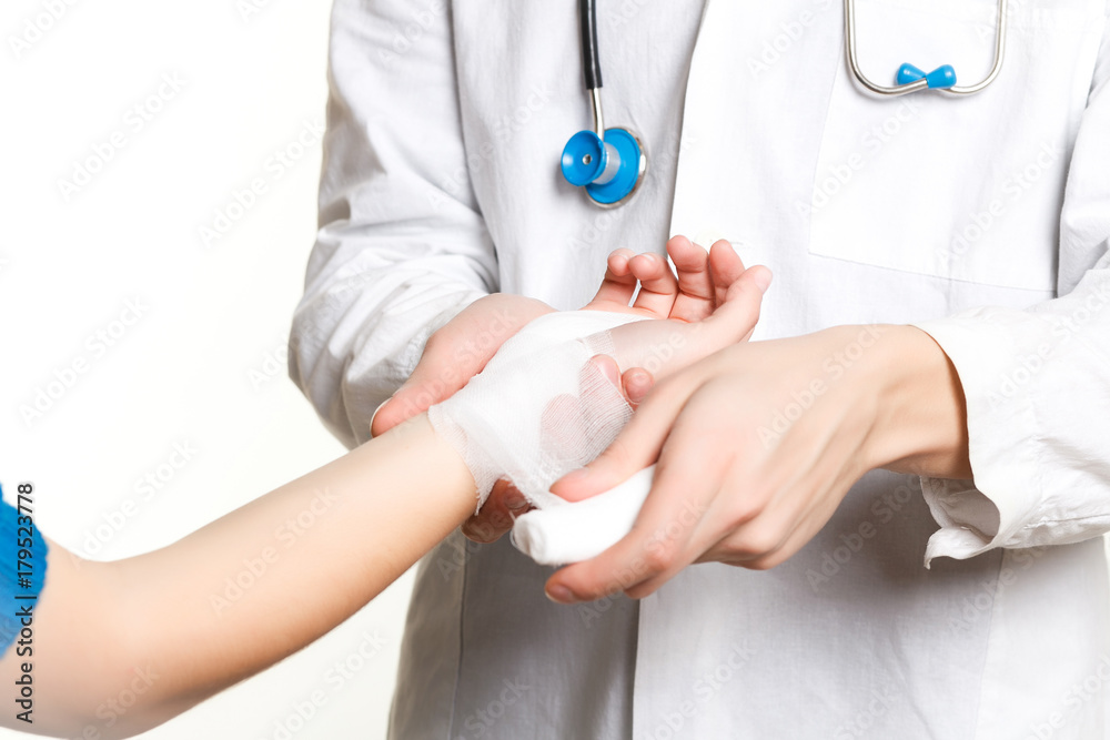 beautiful young doctor in a dressing gown with a stethoscope on a white ...