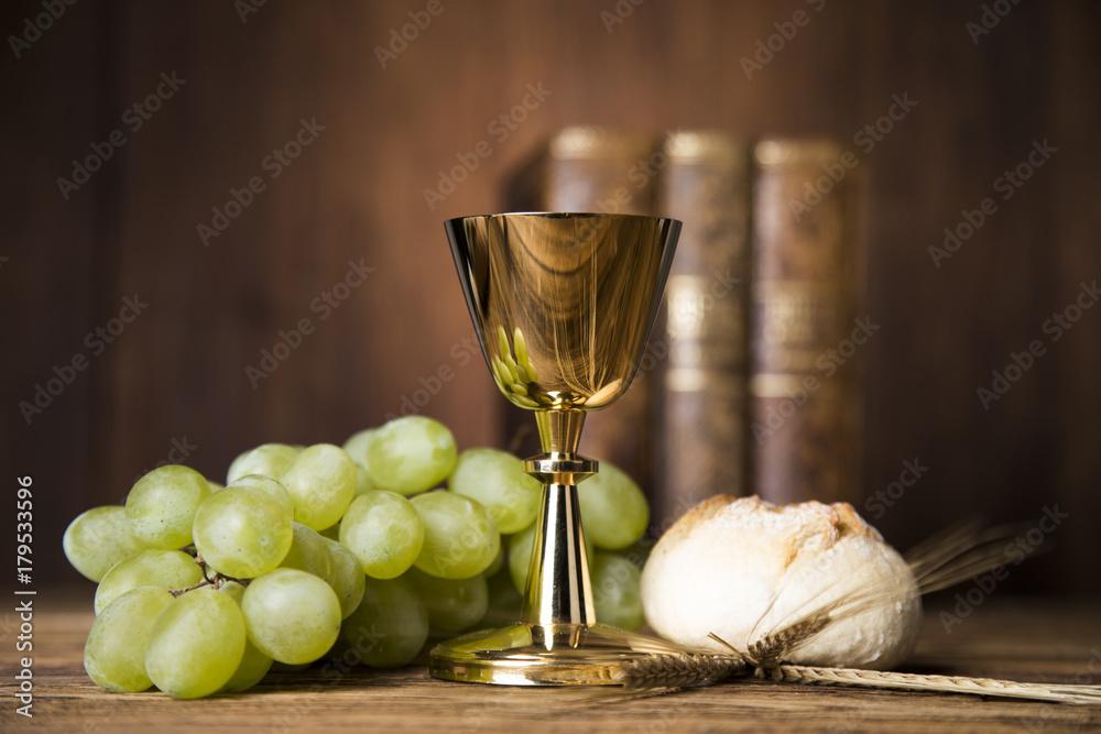 Holy communion a golden chalice with grapes and bread wafers Stock ...