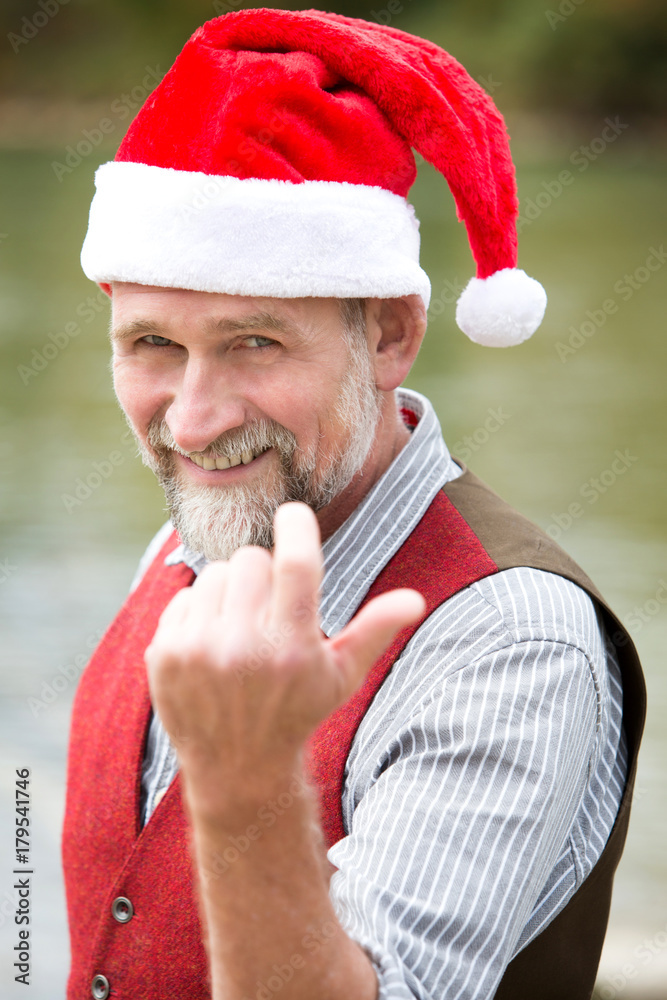 portrait of man in his 50s with Santa hat Stock Photo | Adobe Stock