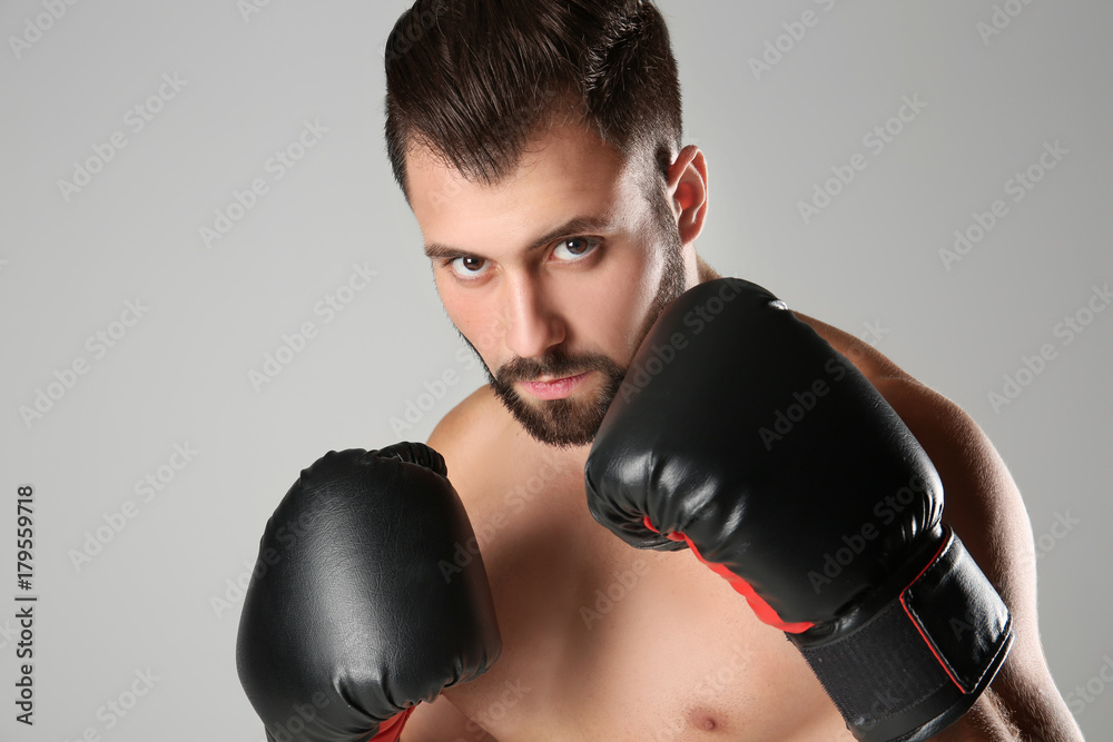 Male boxer on light background Stock-Foto | Adobe Stock
