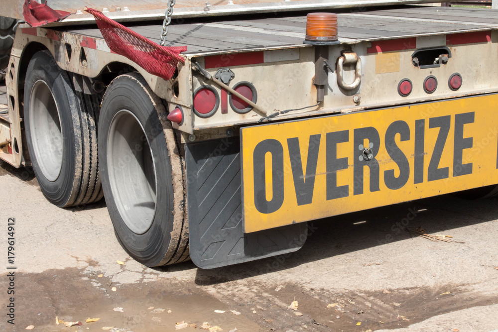 Oversize sign on the back of a semi truck Stock Photo | Adobe Stock