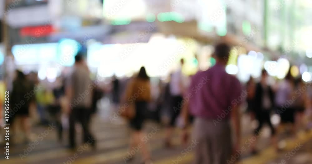 Blurry view of people walking in street at night Stock ビデオ | Adobe Stock
