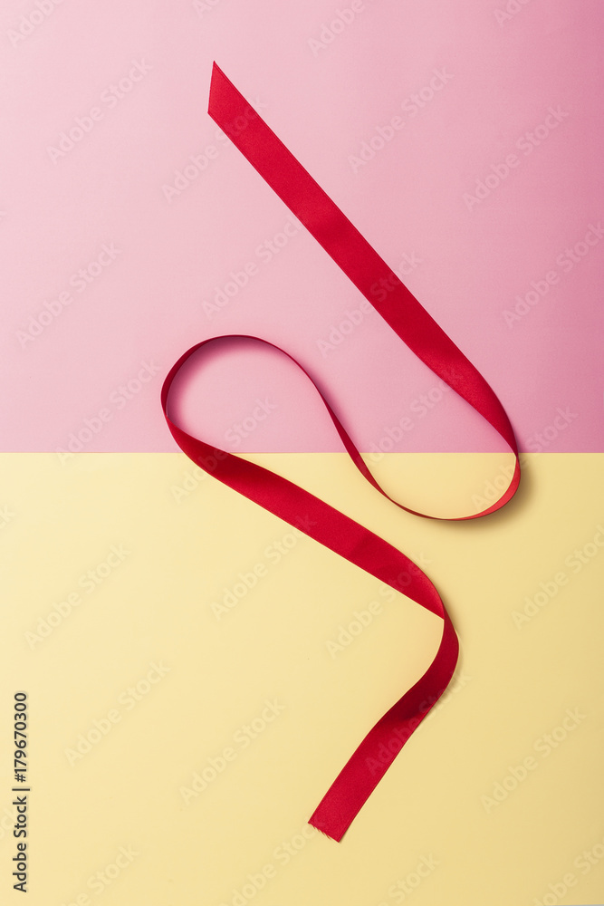 ribbon on the color paper background. Stock Photo | Adobe Stock