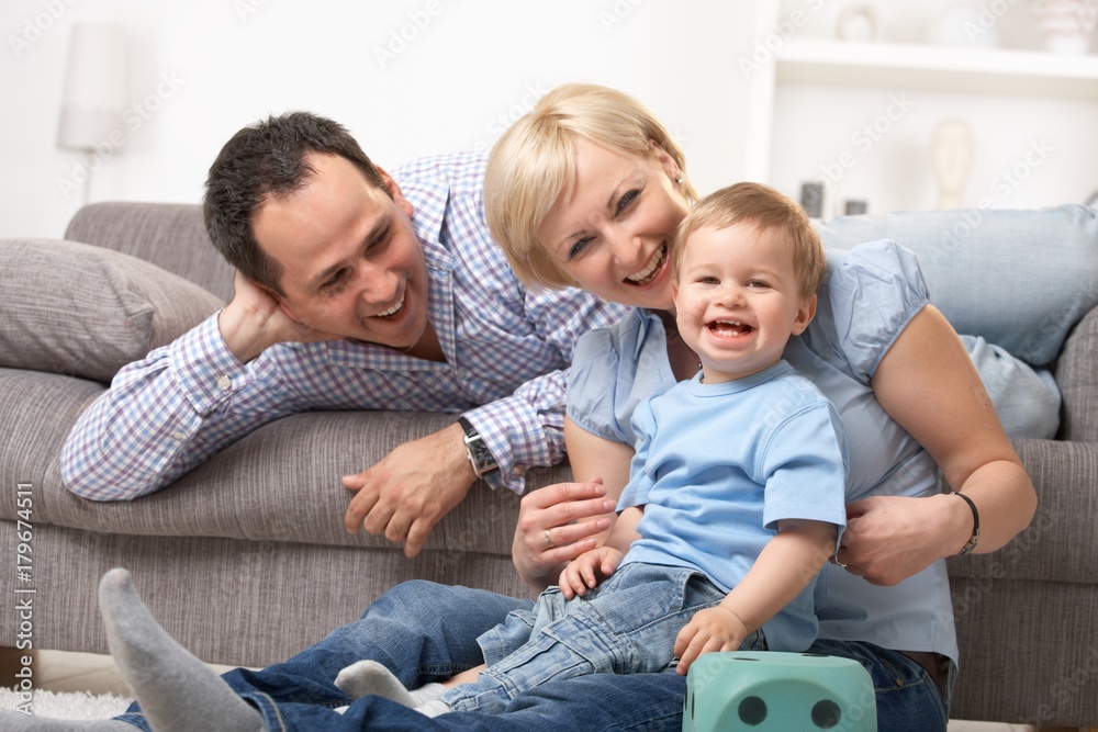 Parents laughing with baby Stock Photo | Adobe Stock