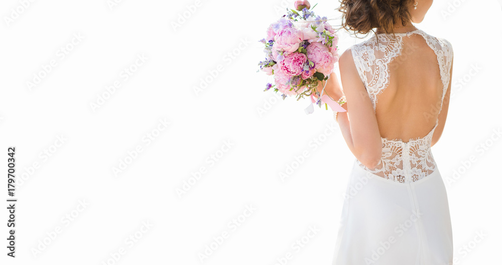 Beautiful bride on a white background. On the bride is a long wedding ...