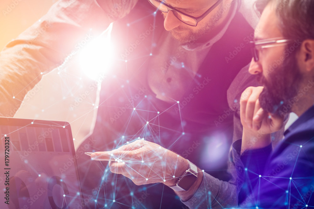 Two colleagues working on new global financial strategy analysis plan ...