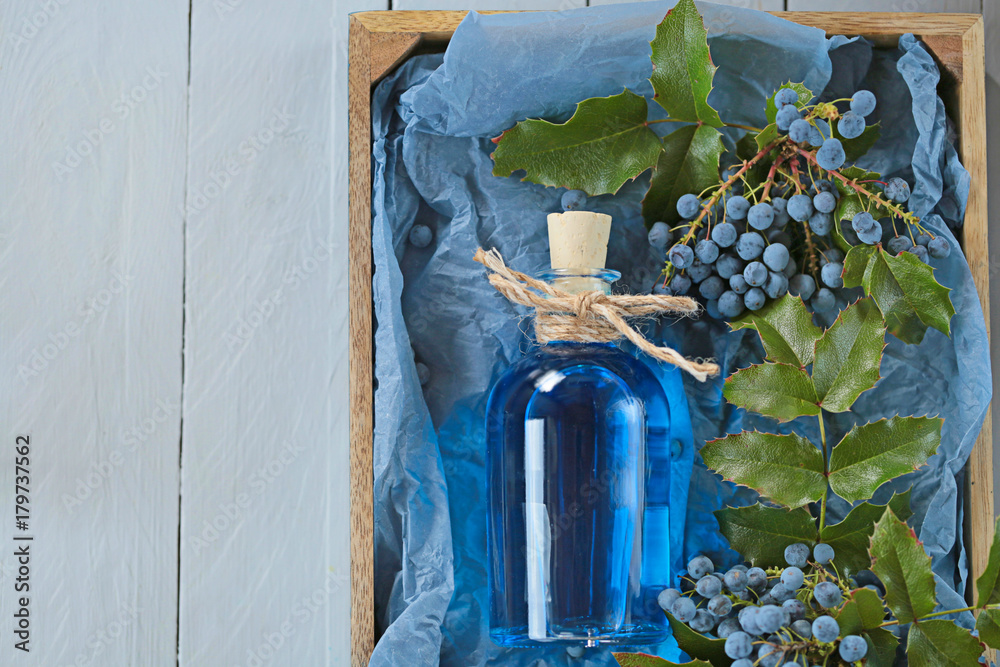 medicinal tincture of Mahonia aquifolium. homeopathic bright blue ...