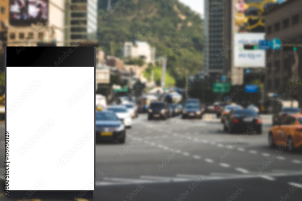 Blank billboard for information on bus stop beside the road, traffic ...