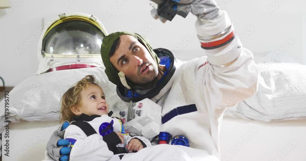 Romantic and family moments of dad and daughter playing with spacecraft ...