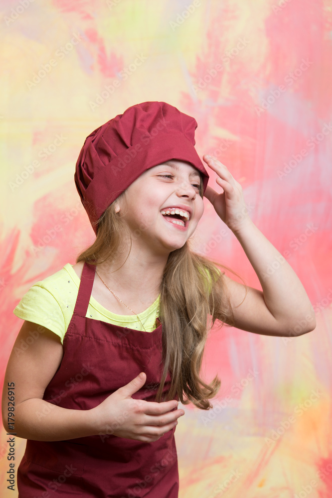 Girl in chef hat and apron Stock Photo | Adobe Stock