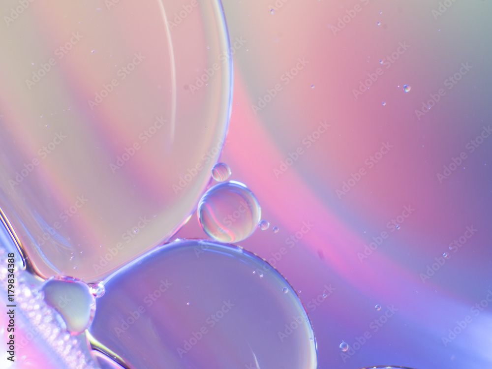 Drops of oil floating in water. Stock Photo | Adobe Stock