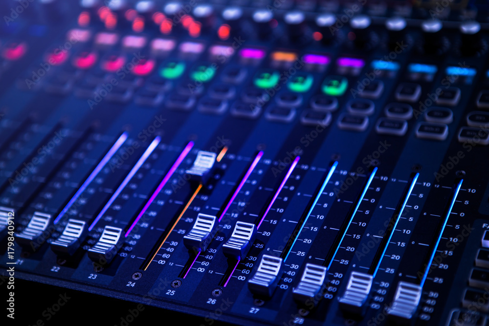 Professional sound and audio mixer control panel with buttons and ...