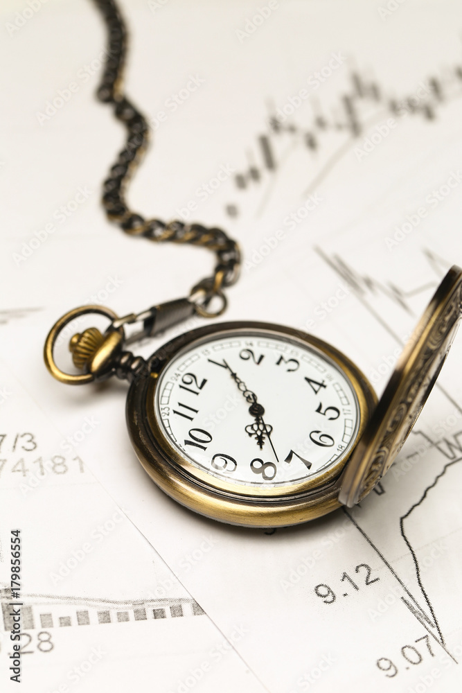 retro pocket watch on stock market chart Stock Photo | Adobe Stock