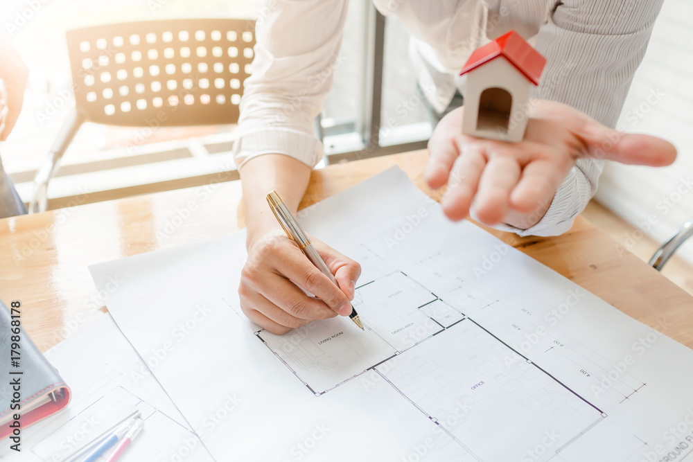 Business architect engineer drawing a house blueprint planning to build ...