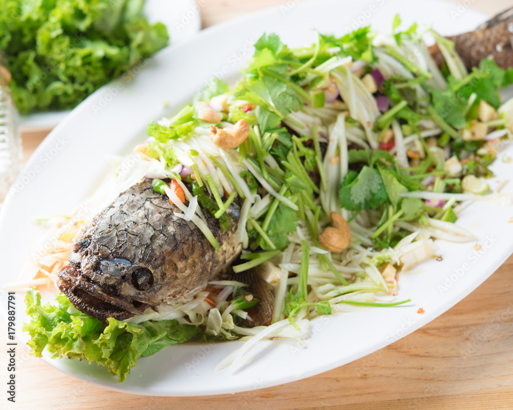 Deep Fried Snakehead Fish with Herb and Spicy Sauce,Thai food Stock ...