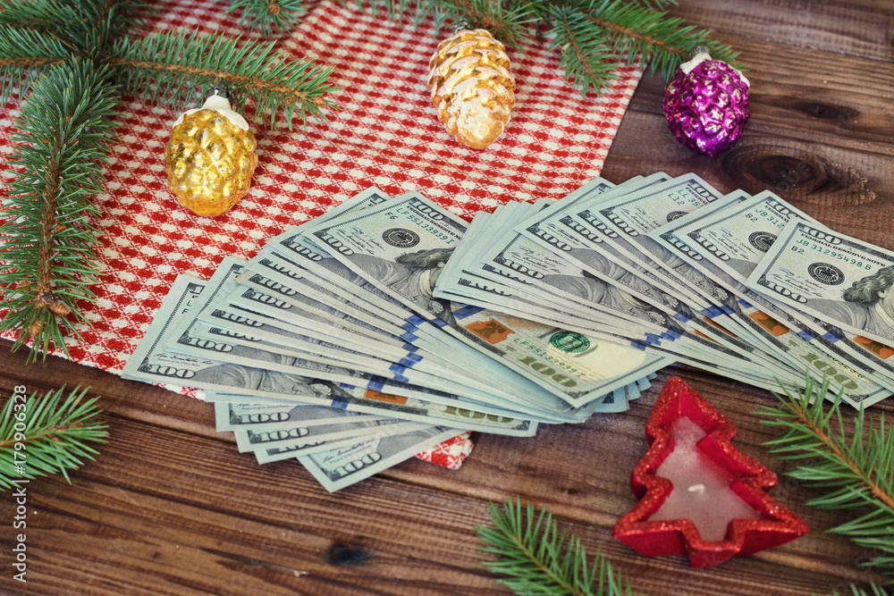 American dollars as a Christmas gif t or a Christmas spending concept ...