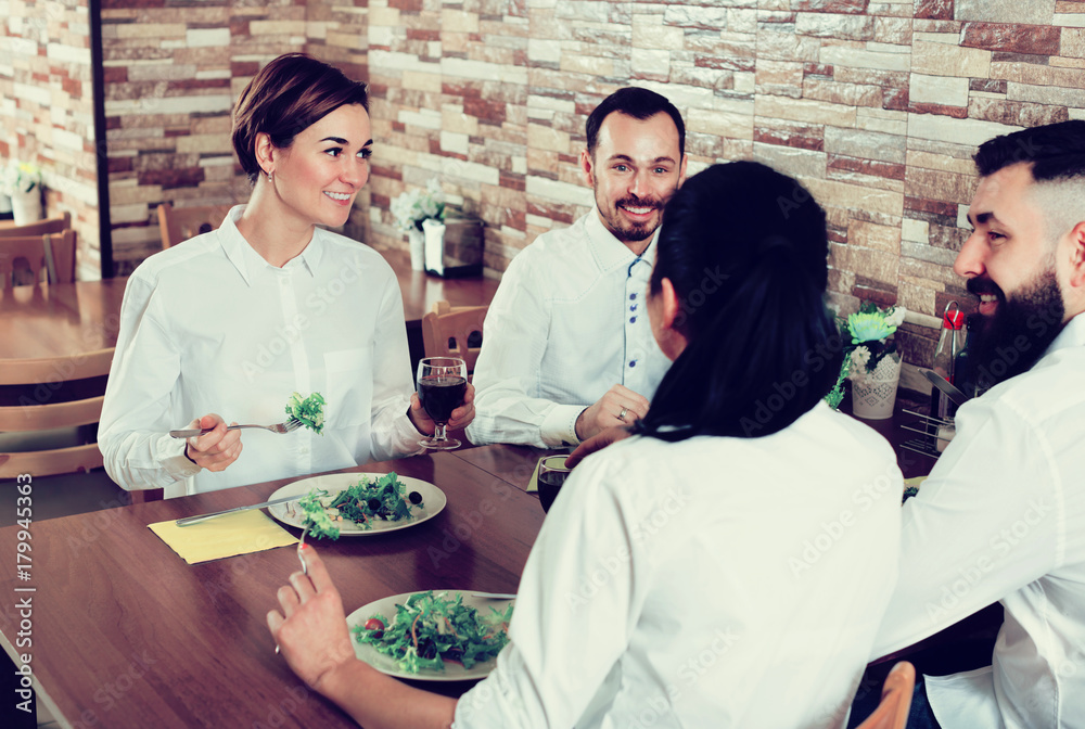 Group of people dining out in restaurant Stock Photo | Adobe Stock