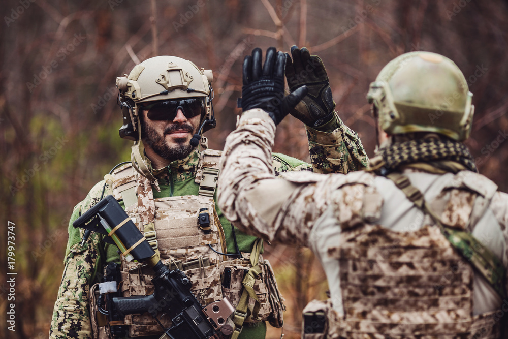 soldiers holding gps in hand and determines the location of coordinates ...
