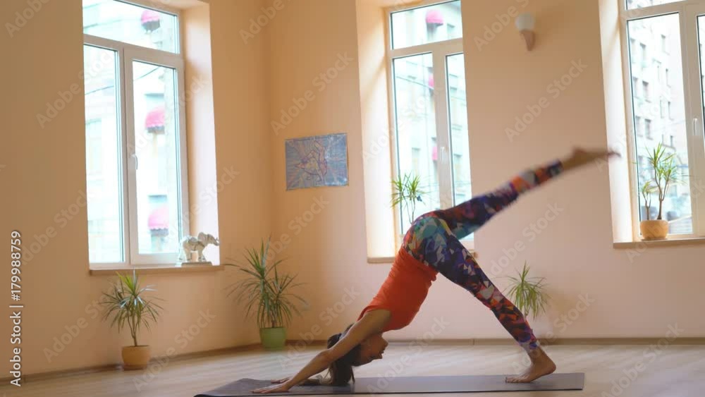 Vidéo Stock A professional yoga instructor demonstrates a set of ...