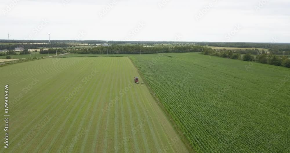 Tractor in farmers field harvesting crop - aerial shot from above Stock ...
