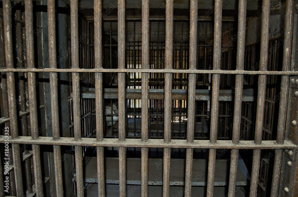 Iron bars of an old jail cell Stock Photo | Adobe Stock
