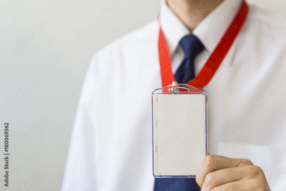 Man holding ID card Stock Photo | Adobe Stock
