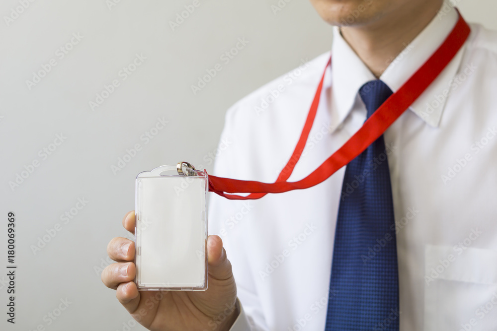 Man holding ID card Stock Photo | Adobe Stock