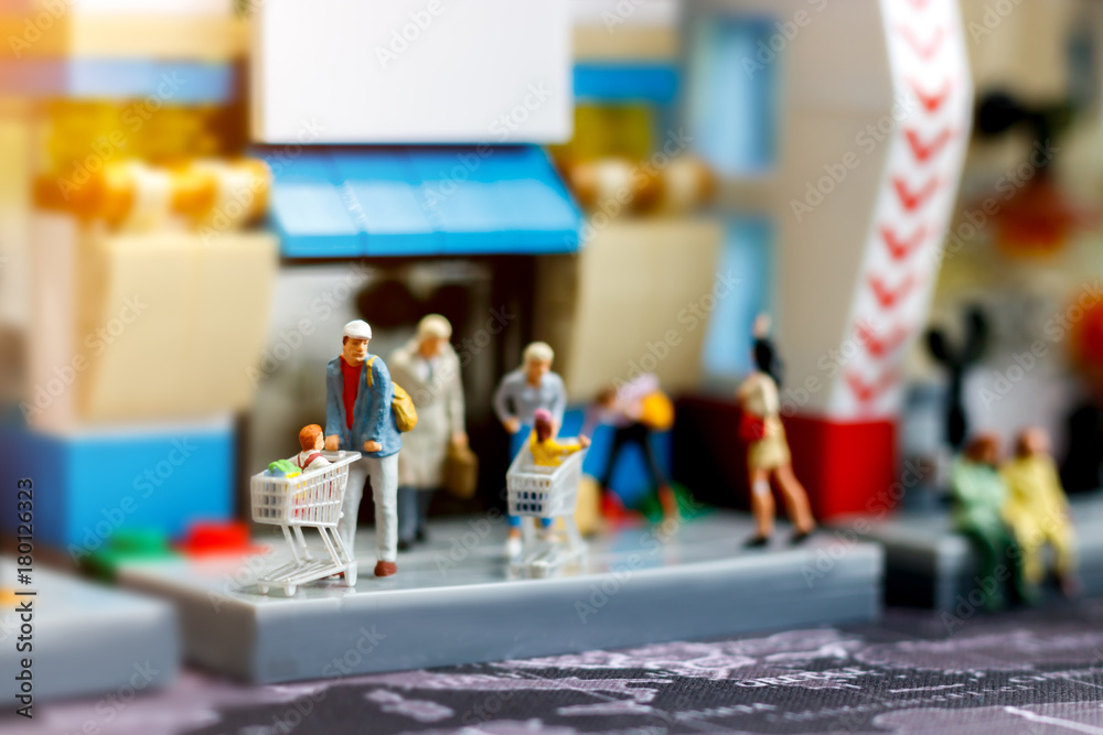 Miniature people family with shopping cart in supermarket, Tourism ...